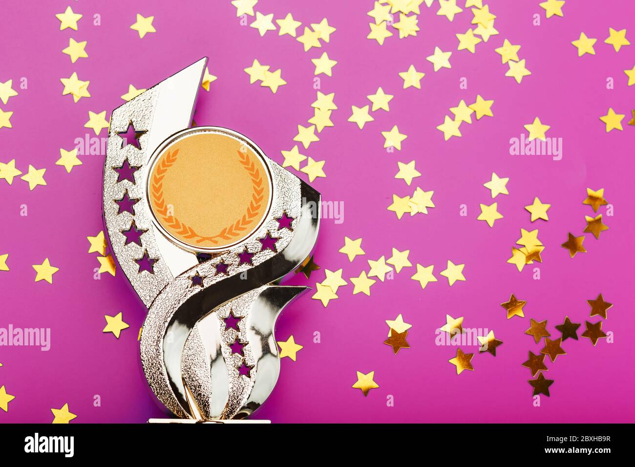 Superprize of gold with fireworks of stars on a pink background Stock ...