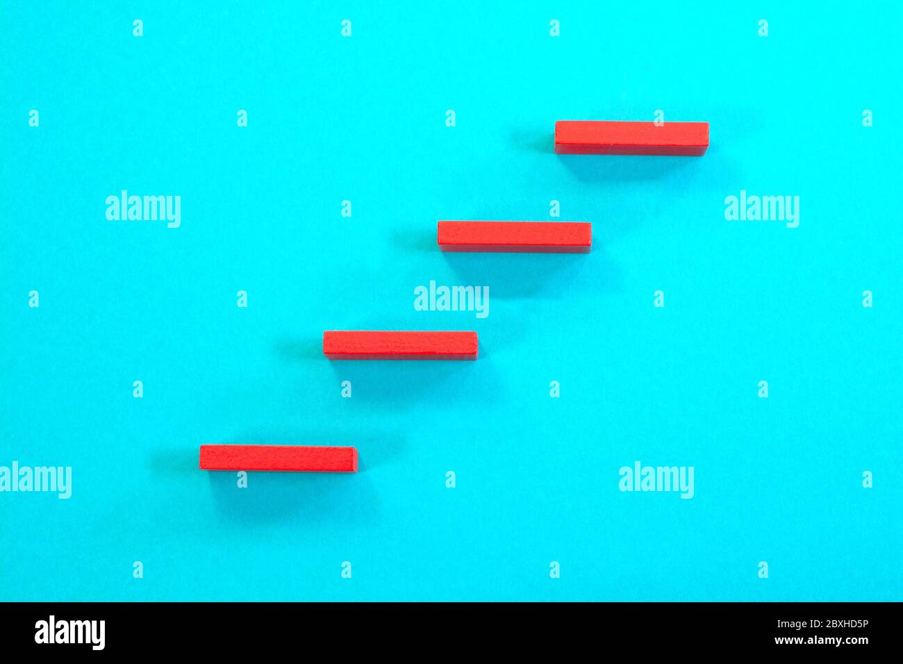 Steps to success. Red steps on blue background Stock Photo - Alamy