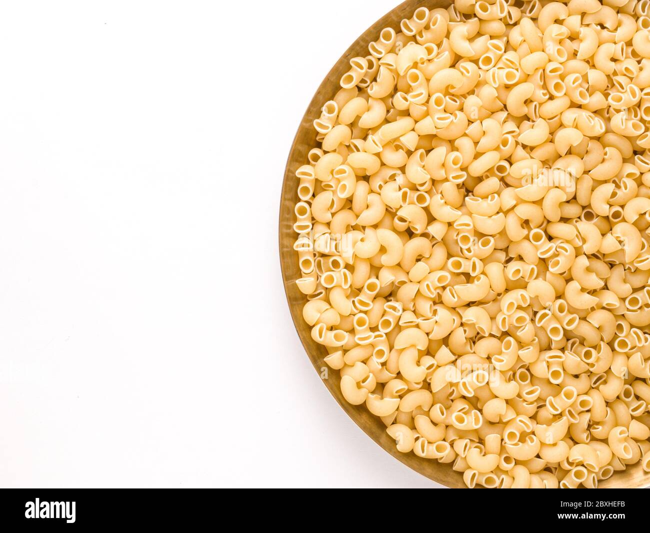 Uncooked macaroni elbow shape pasta with white background stock image ...