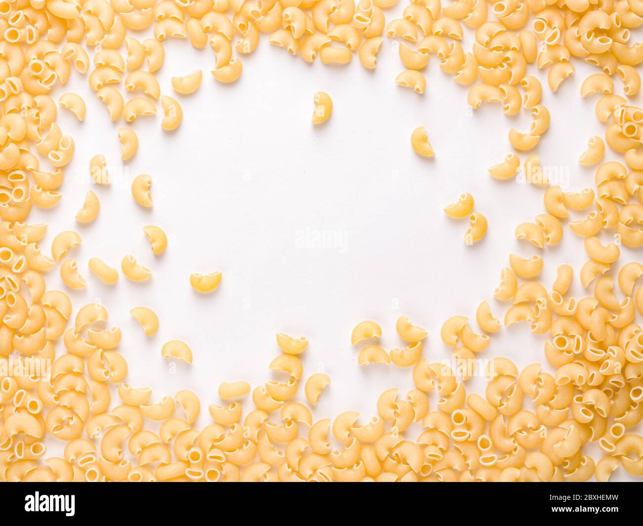 Uncooked macaroni elbow shape pasta with white background stock image ...