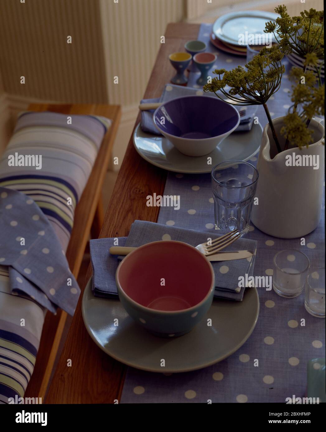 Supper table set with polka dot table linen Stock Photo - Alamy