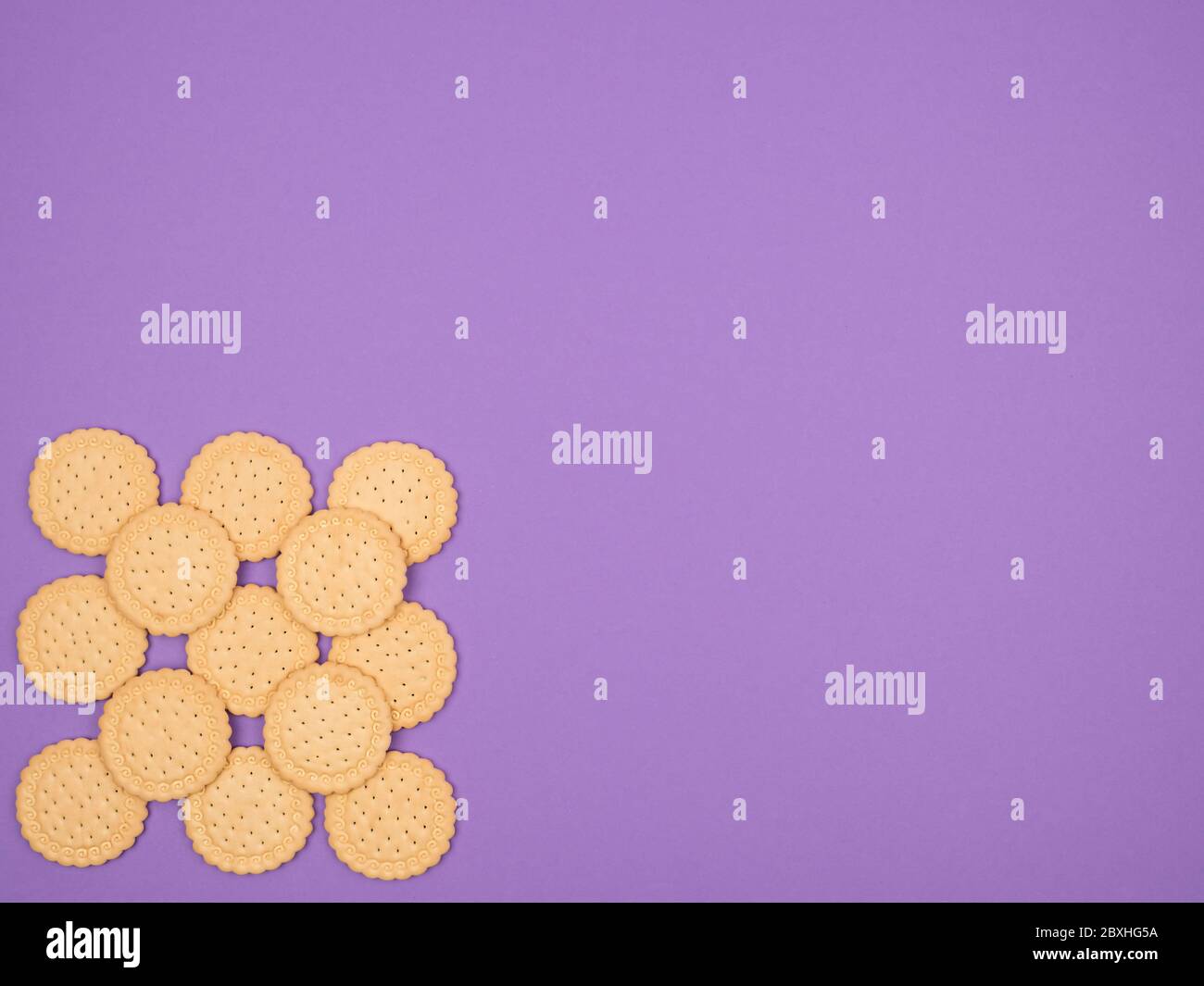 The square of the round cookie on a purple background Stock Photo - Alamy