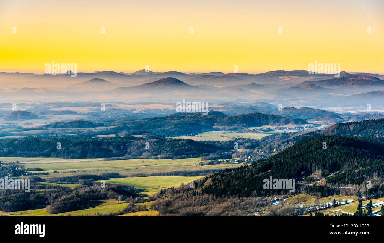 Hilly landscape on sunny and foggy day. Weather inversion. Central ...