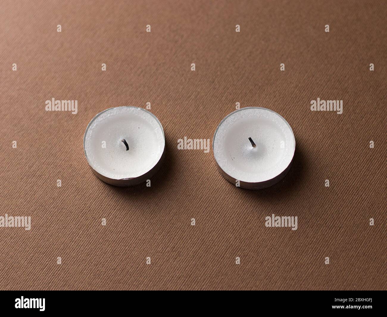 White candle isolated photos in a minimal background Stock Photo - Alamy
