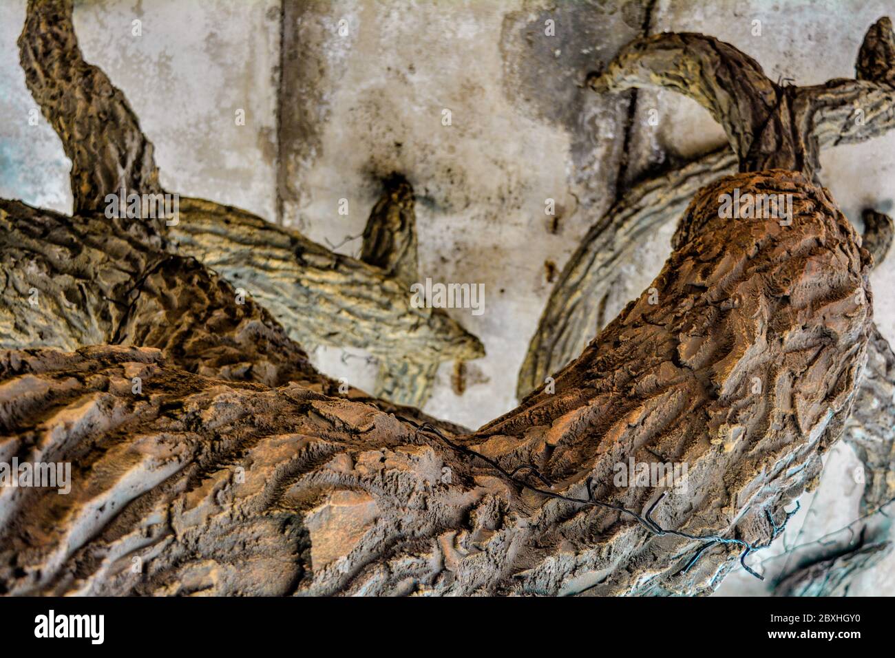 Clumsy artificial tree supports roof like decorative pillar ...