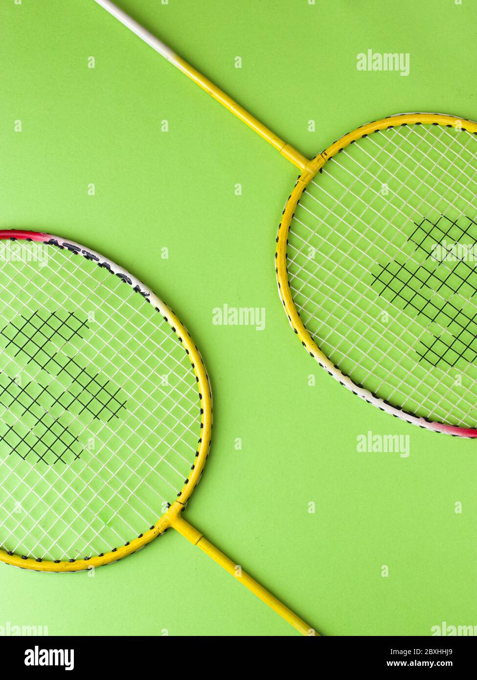 Badminton racket and White Feather Shuttlecock with a colour green ...