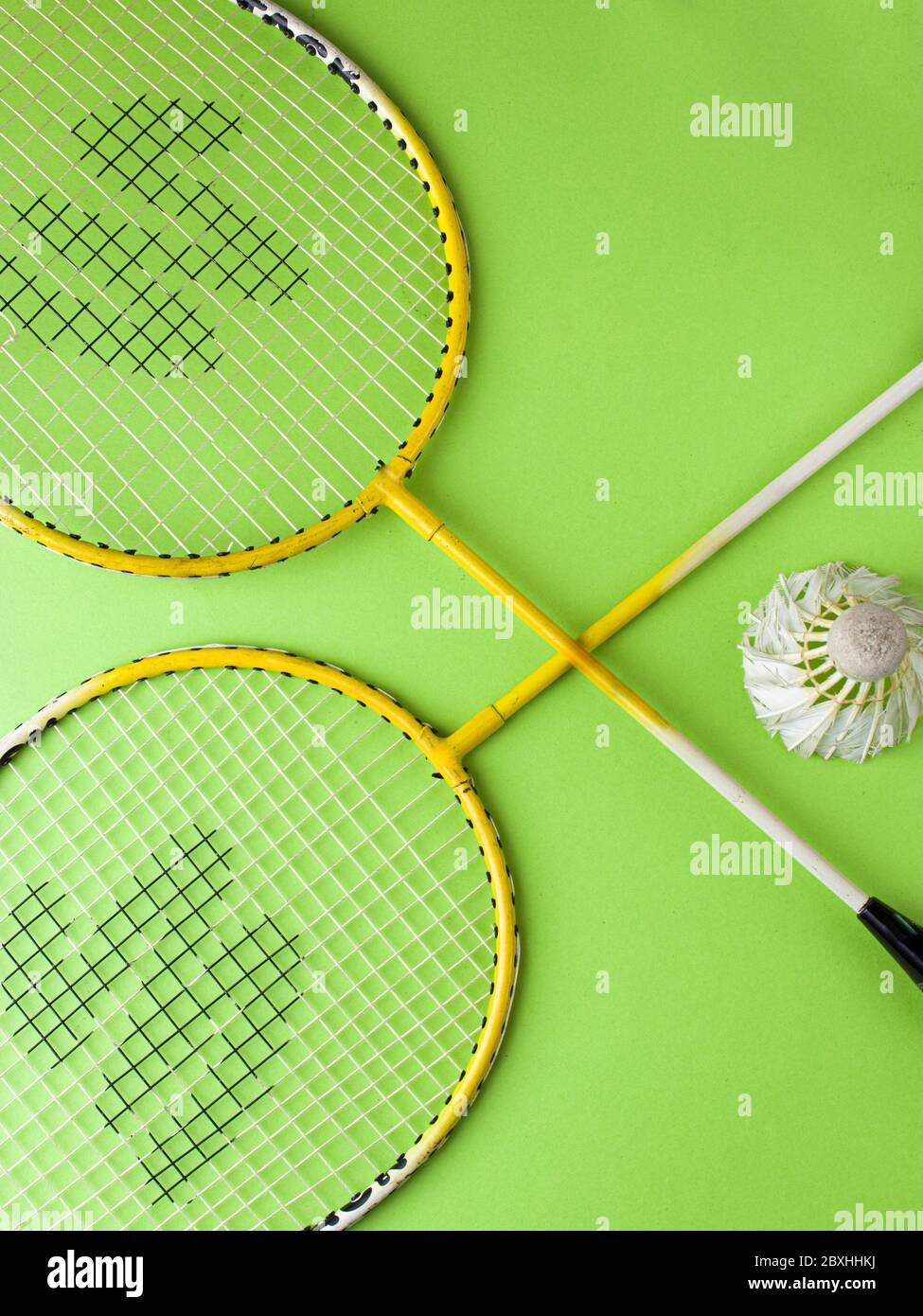 Badminton racket and White Feather Shuttlecock with a colour green ...