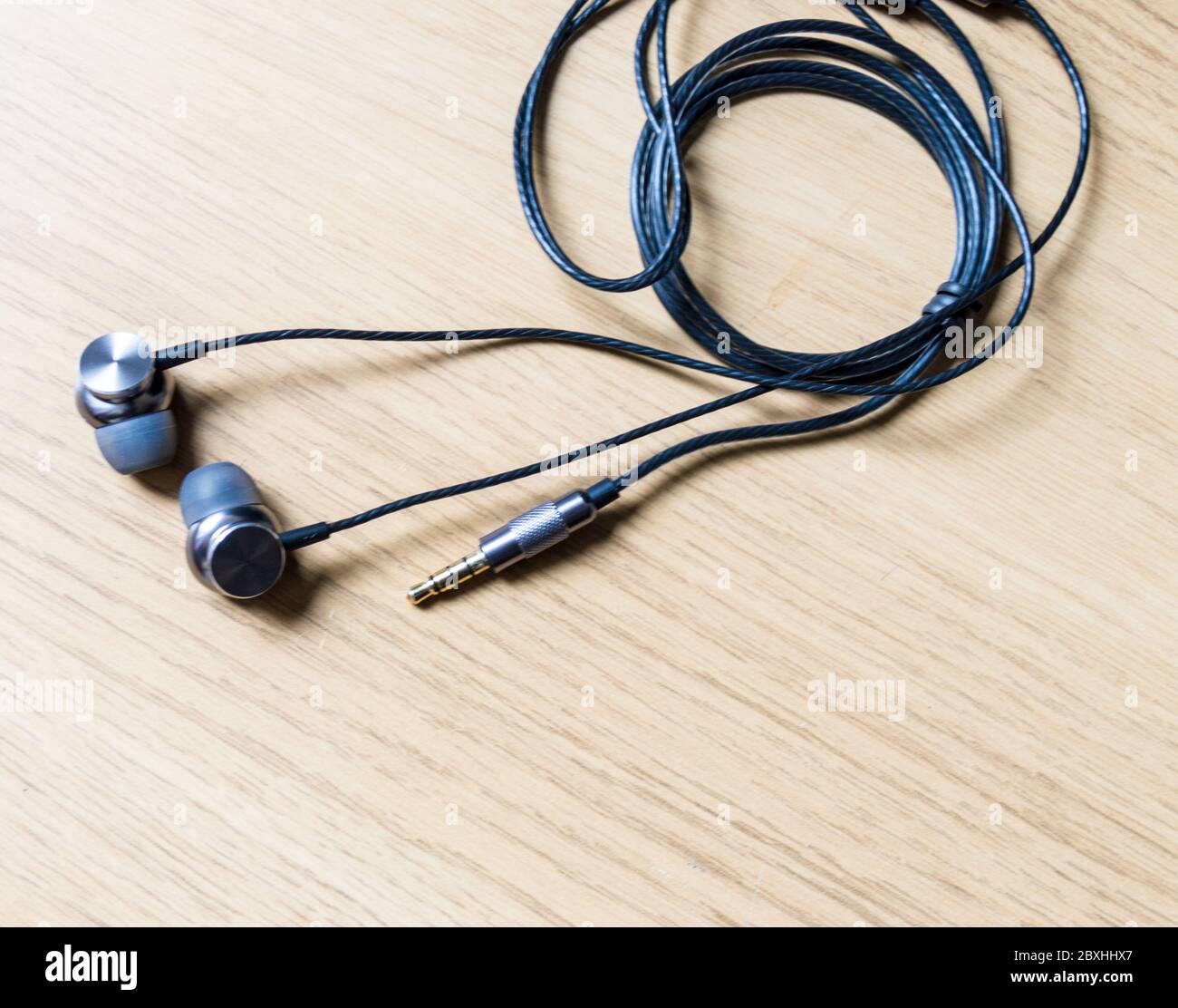In-ear headphones with 3.5mm mini stereo jack pin Stock Photo - Alamy