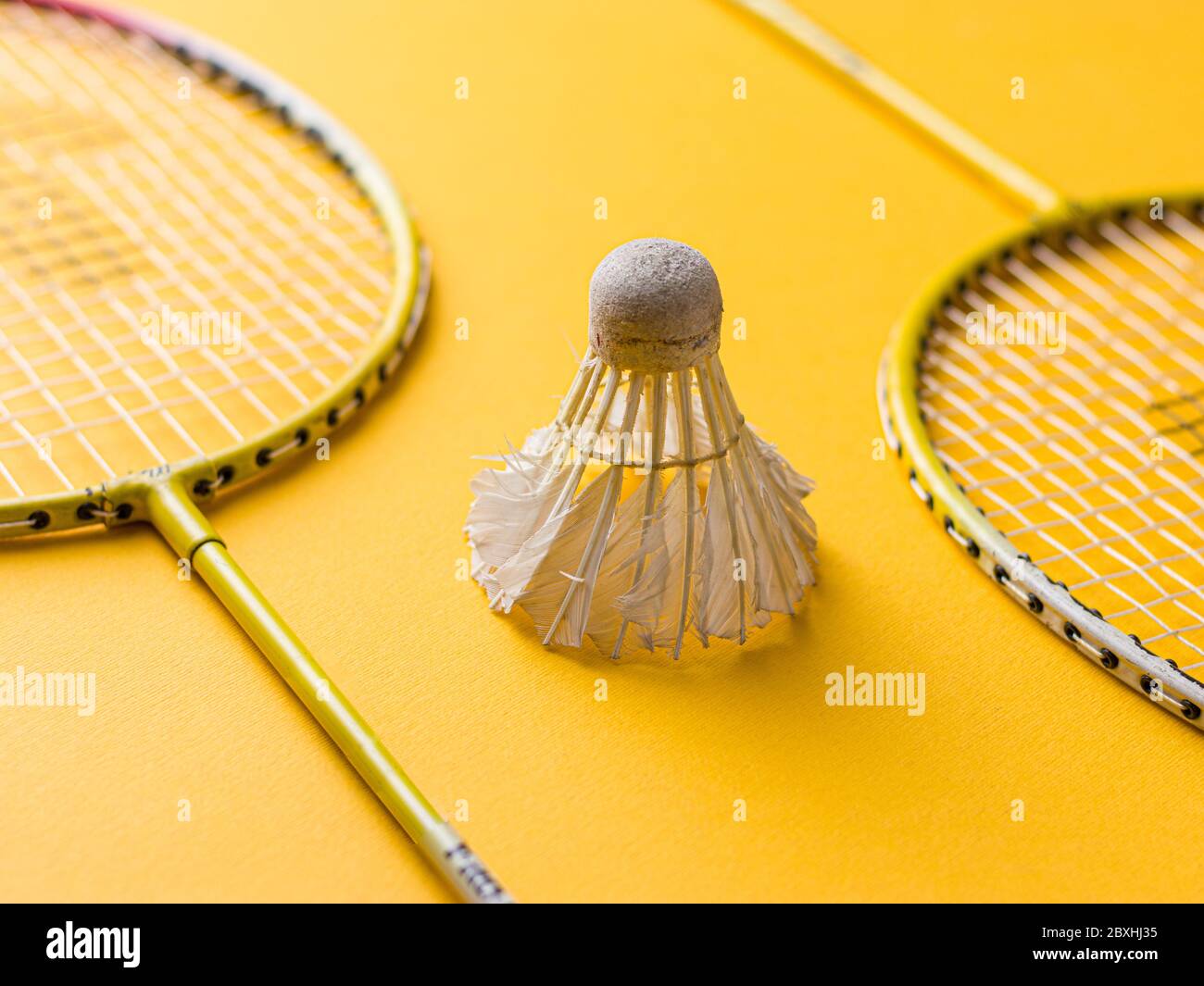 Badminton racket and White Feather Shuttlecock with a colour green ...