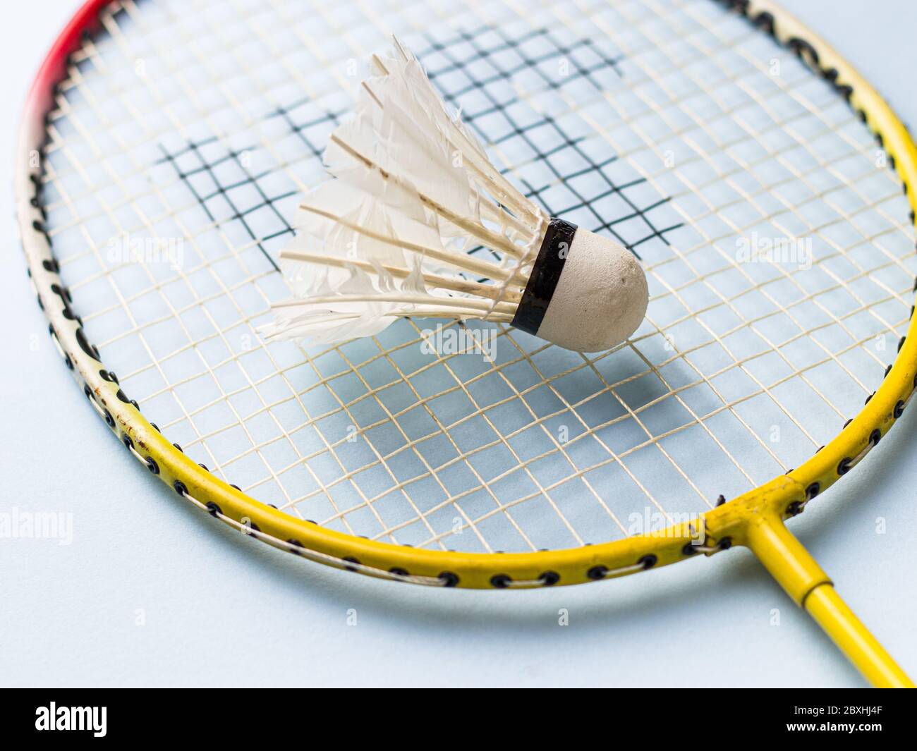 Badminton racket and White Feather Shuttlecock with a colour green ...