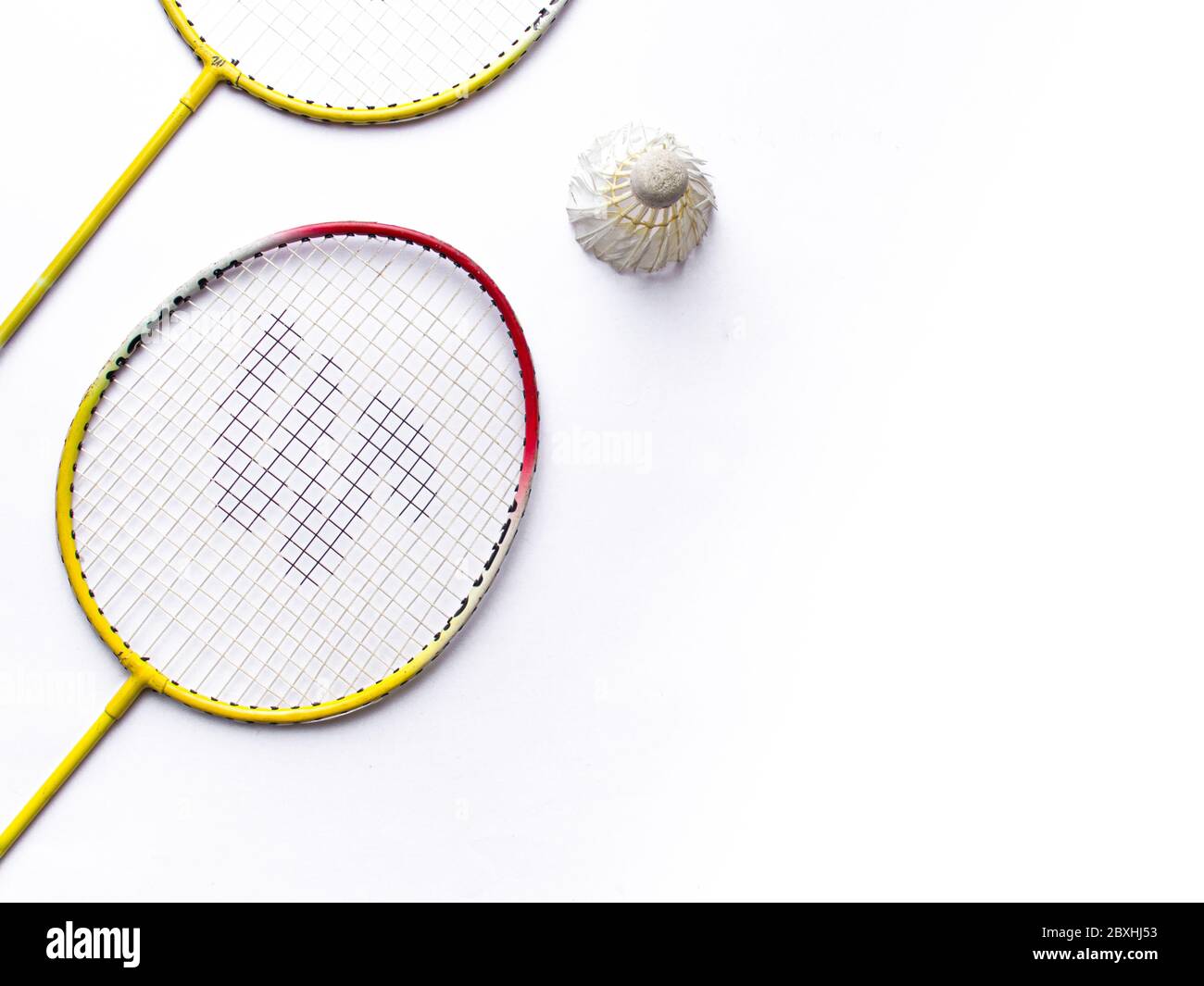 Badminton racket and White Feather Shuttlecock with a colour green ...