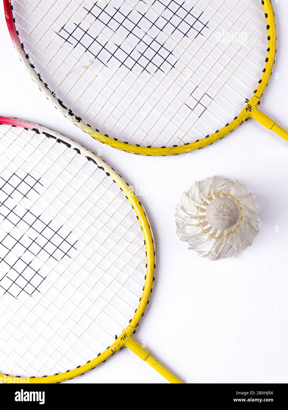 Badminton racket and White Feather Shuttlecock with a colour green ...