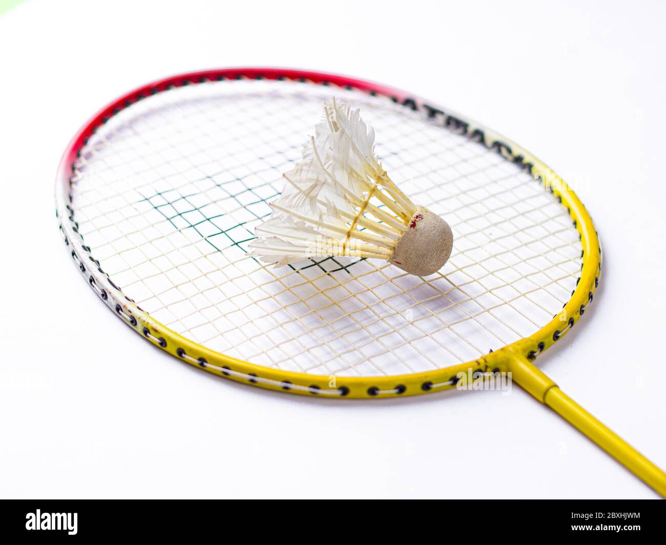 Badminton racket and White Feather Shuttlecock with a colour green ...