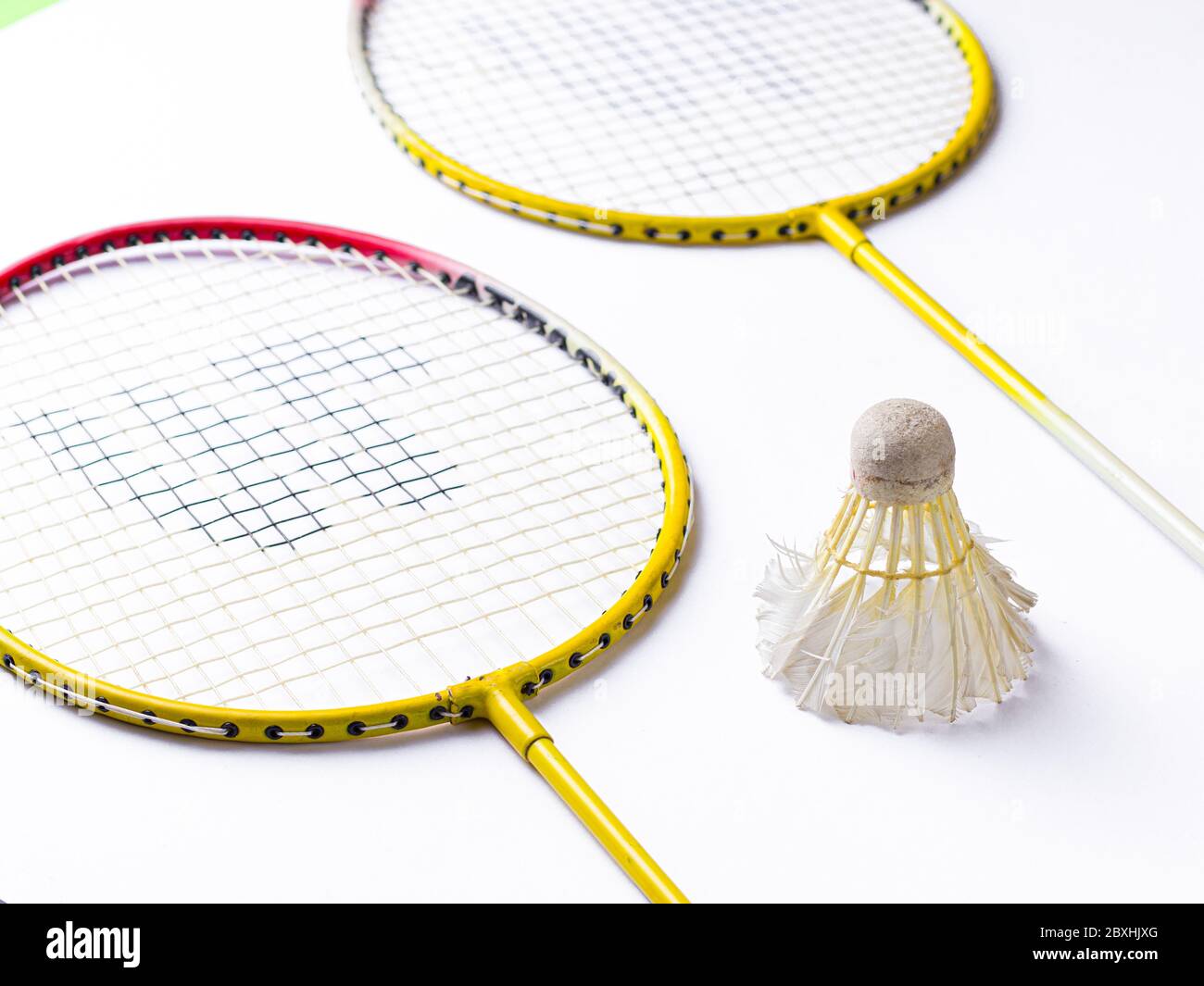 Badminton racket and White Feather Shuttlecock with a colour green ...