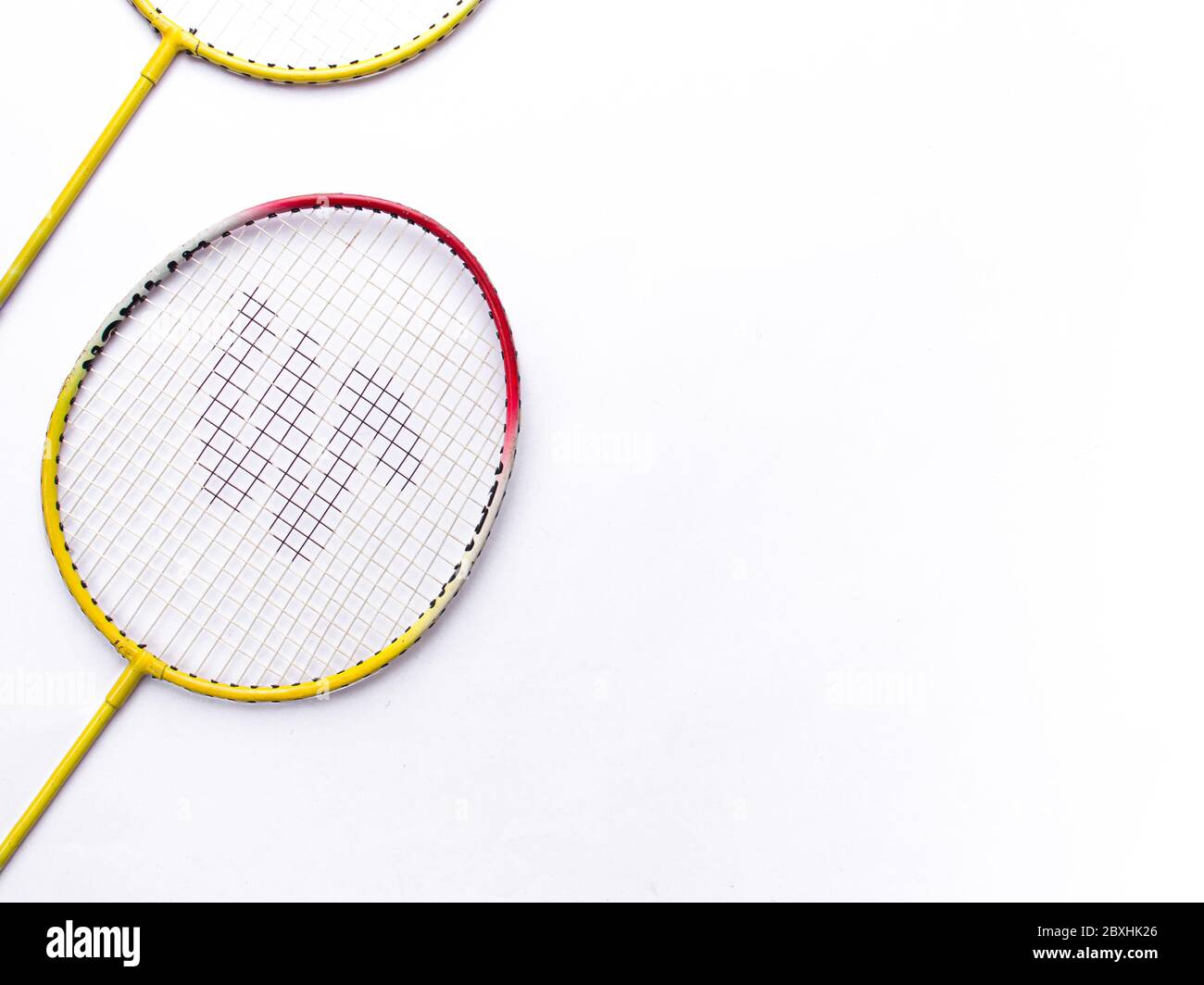 Badminton racket and White Feather Shuttlecock with a colour green ...