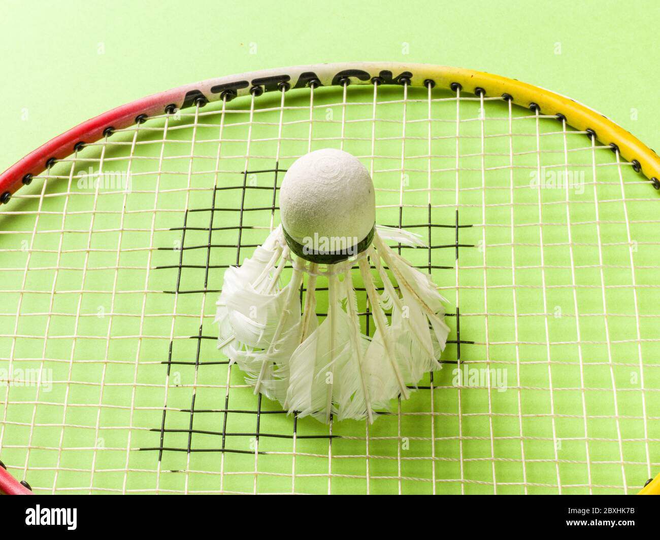 Badminton racket and White Feather Shuttlecock with a colour green ...