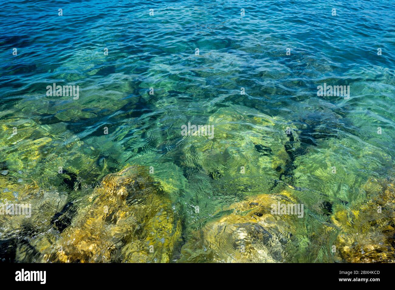 Clean and clear sea water. Paradise rocky shore Stock Photo - Alamy
