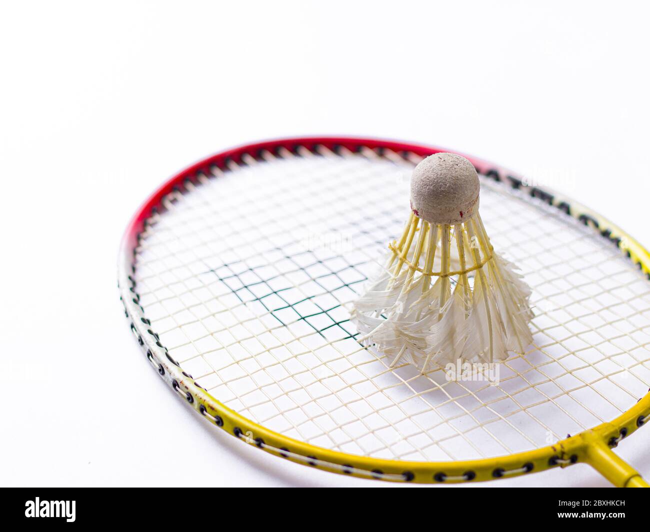 Badminton racket and White Feather Shuttlecock with a colour green ...