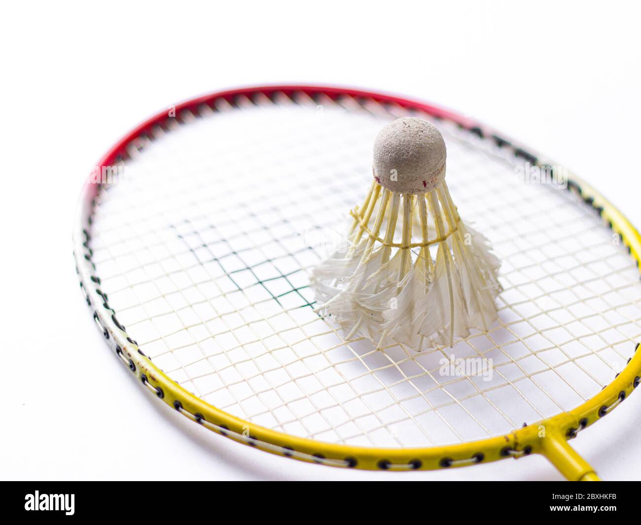 Badminton racket and White Feather Shuttlecock with a colour green ...