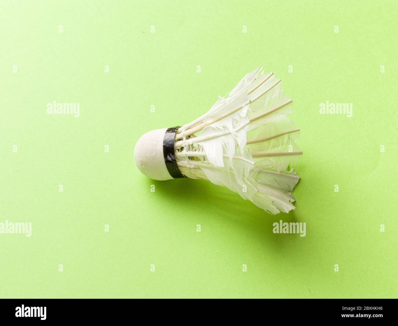 Badminton racket and White Feather Shuttlecock with a colour green ...