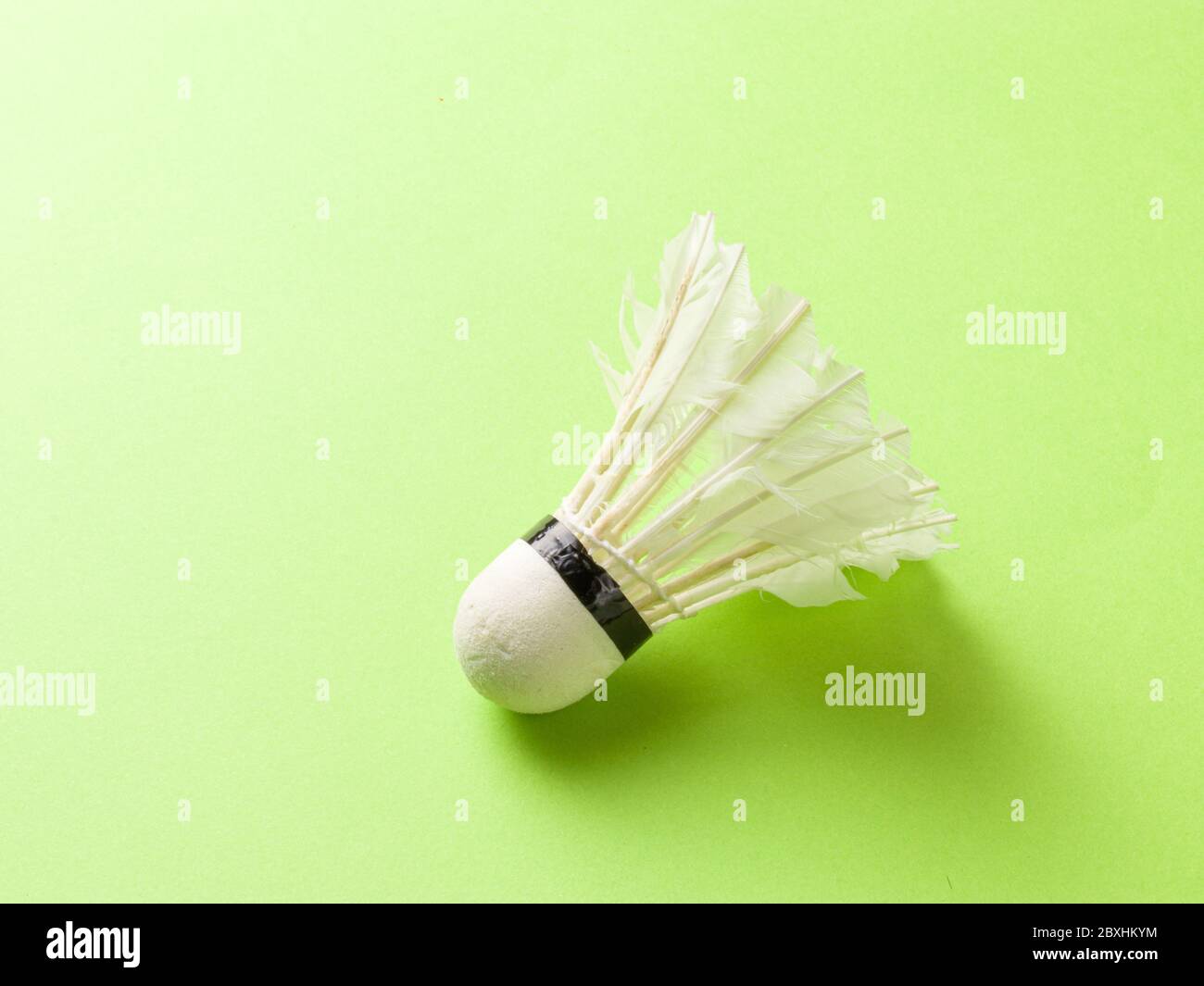 Badminton racket and White Feather Shuttlecock with a colour green ...