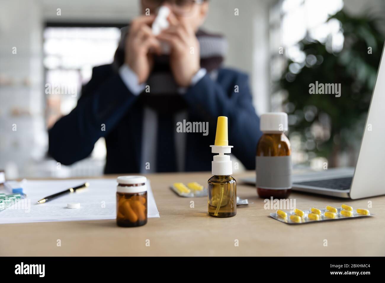 Close up of sick worker take medications at workplace Stock Photo - Alamy