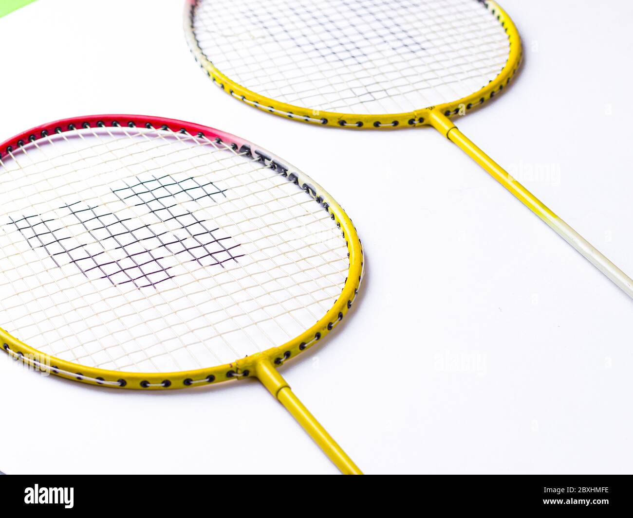 Badminton racket and White Feather Shuttlecock with a colour green ...