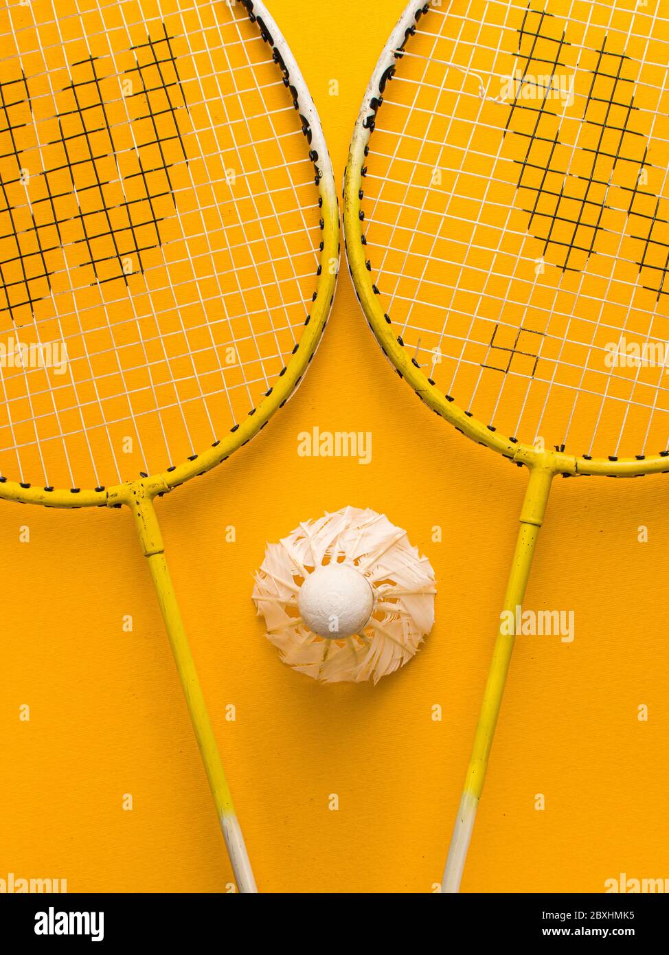 Badminton racket and White Feather Shuttlecock with a colour green ...