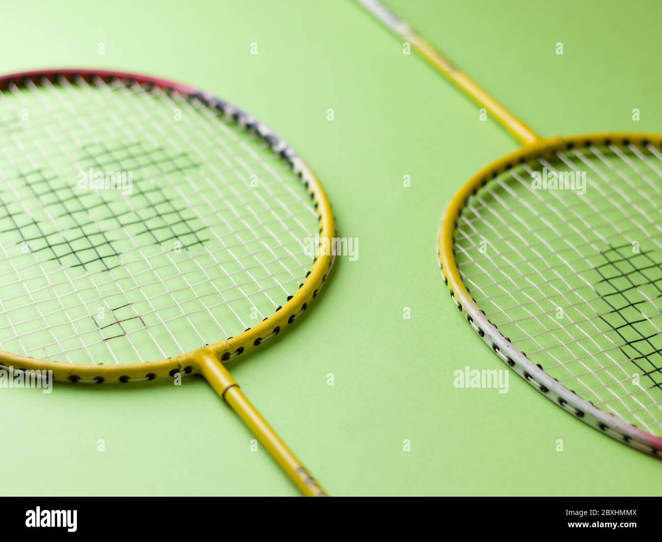 Badminton racket and White Feather Shuttlecock with a colour green ...