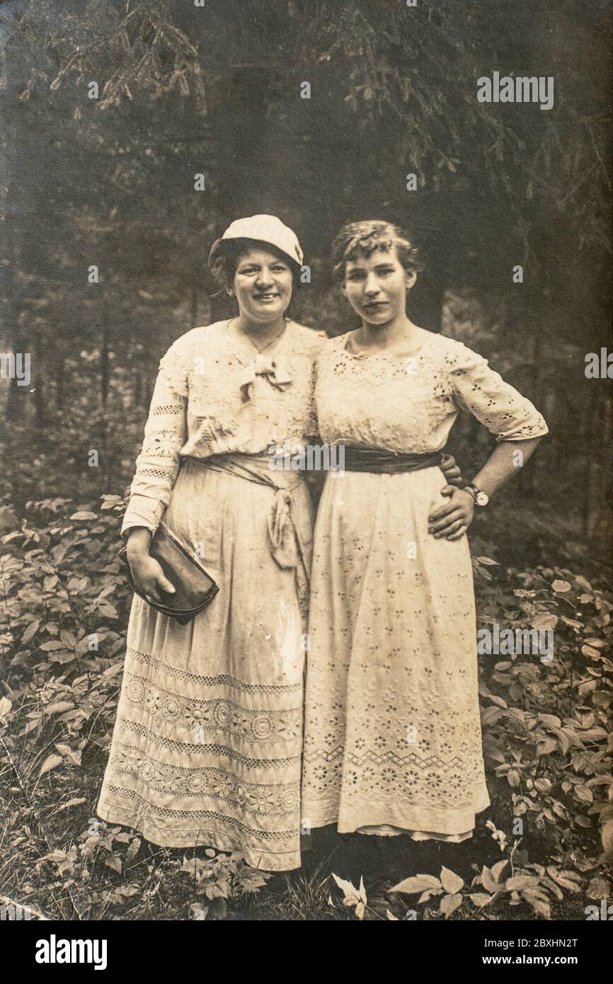 Latvia - CIRCA 1920s: Full body shot of two young women in forest ...