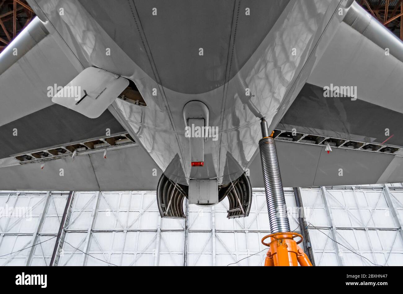 Auxiliary power plant in the tail of the aircraft with open hood covers ...