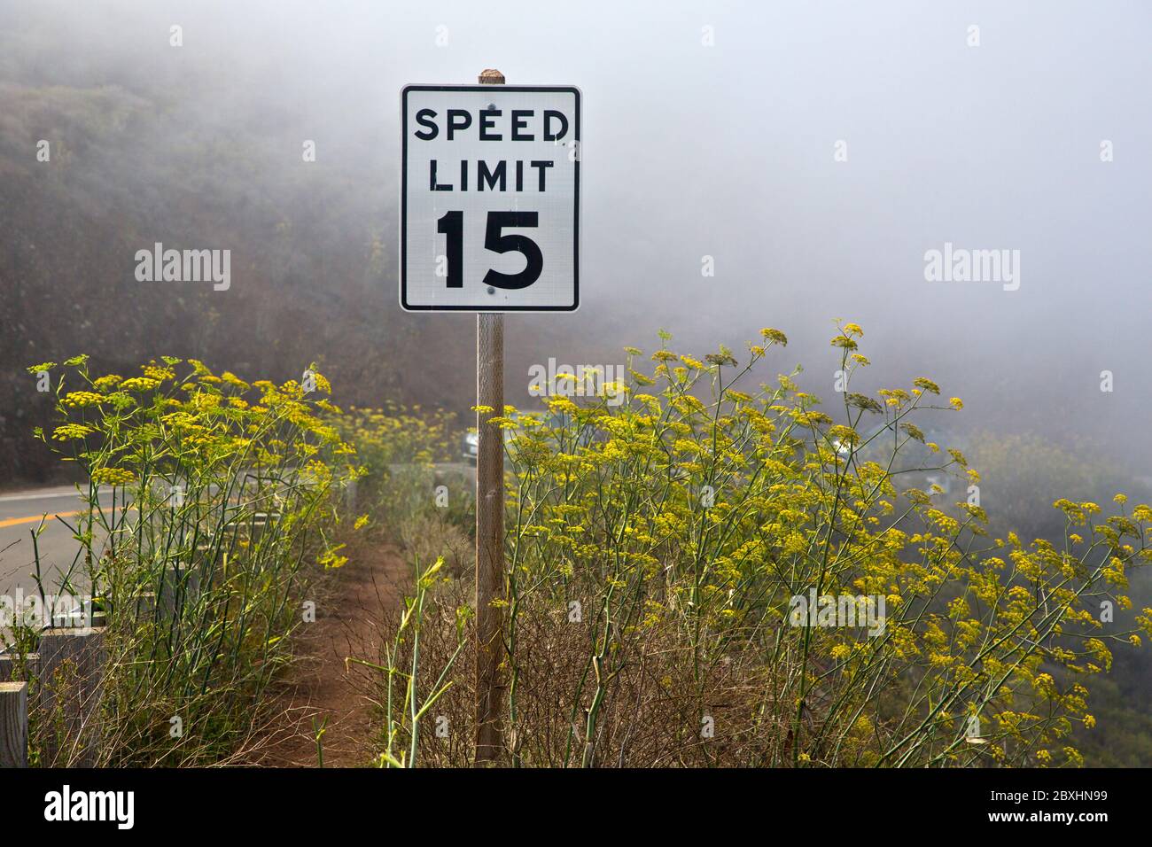 Speed limit sign in the fog Stock Photo - Alamy