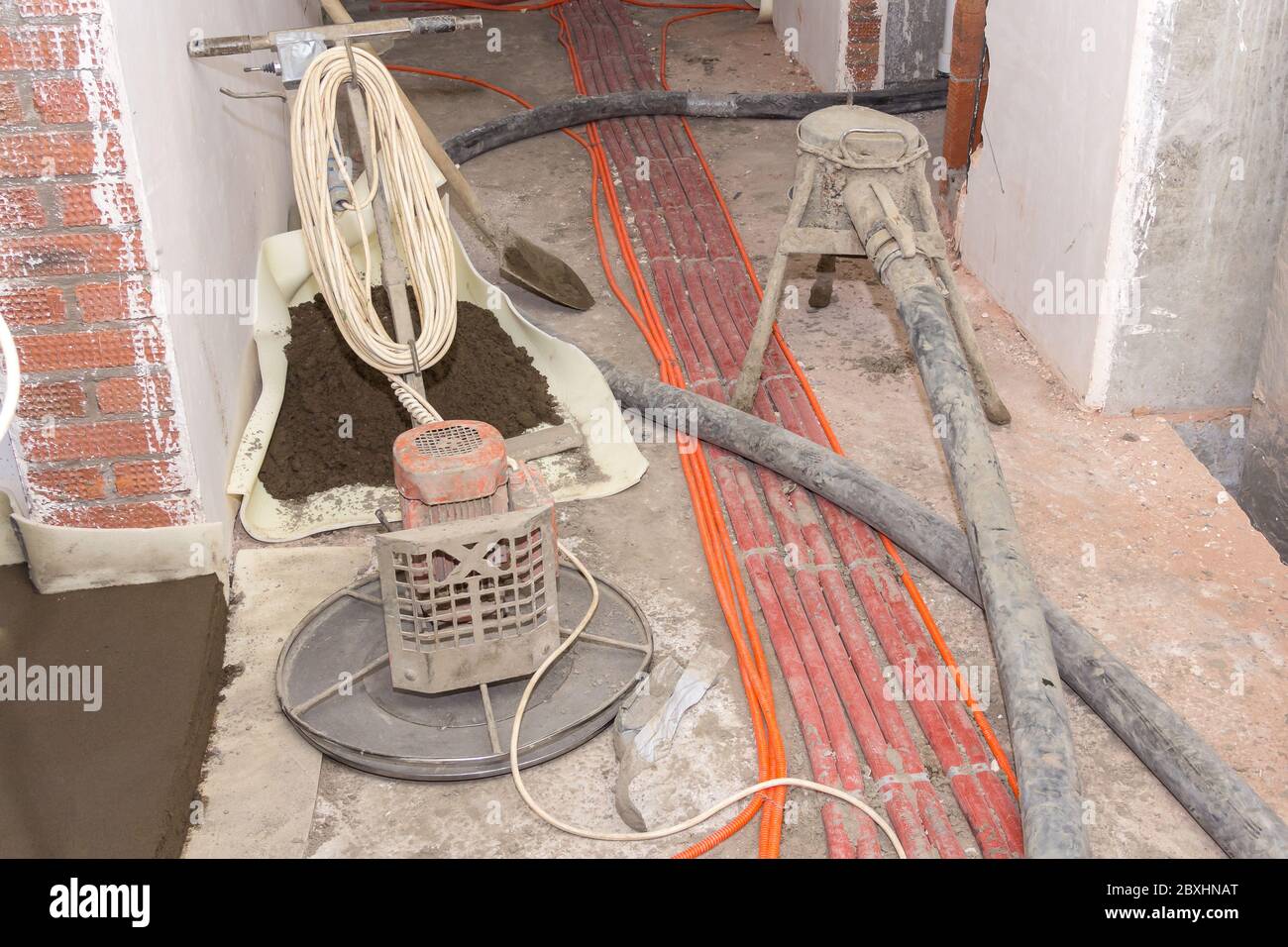 The process of filling floors in a new house. Concrete floors in a new ...