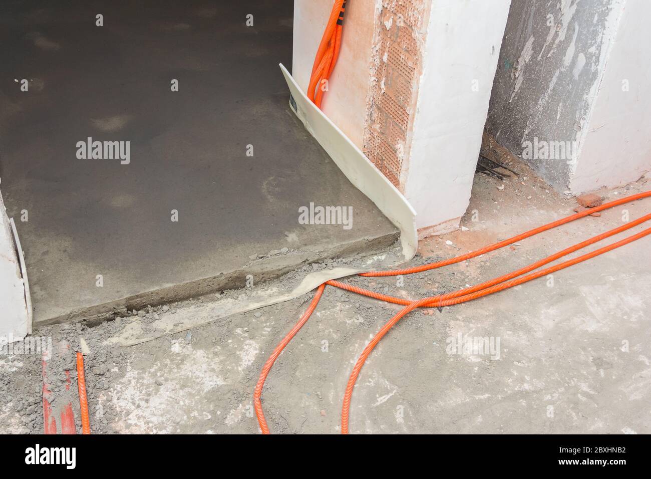 The process of filling floors in a new house. Concrete floors in a new ...