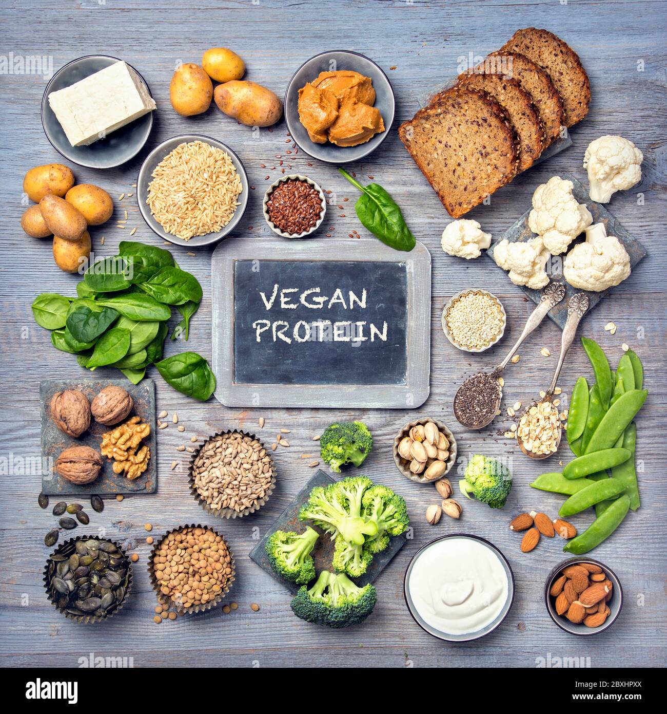 Vegan protein sources. Top view on a grey wooden background Stock Photo ...
