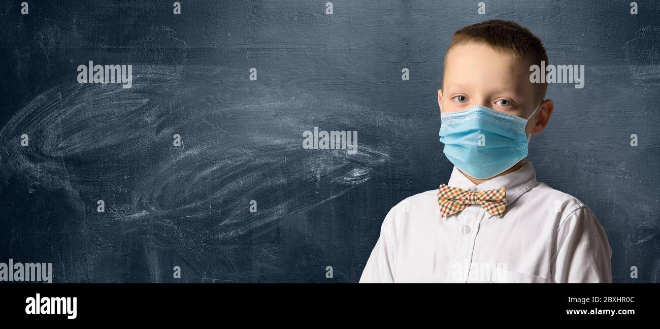 Happy school boy in mask Stock Photo - Alamy