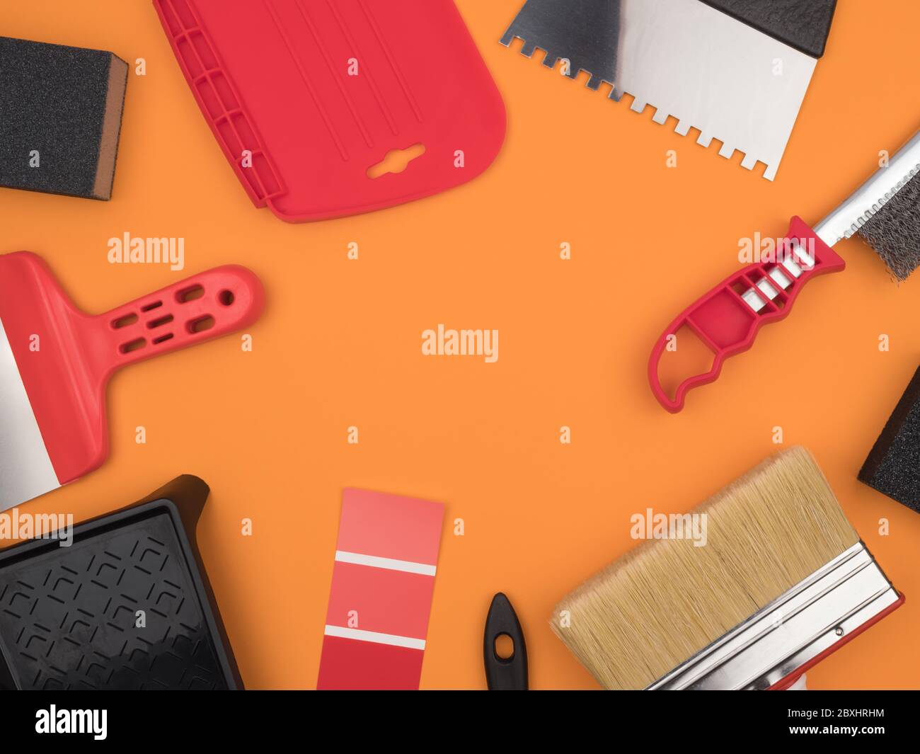 Tool painter plasterer on a orange background Stock Photo - Alamy
