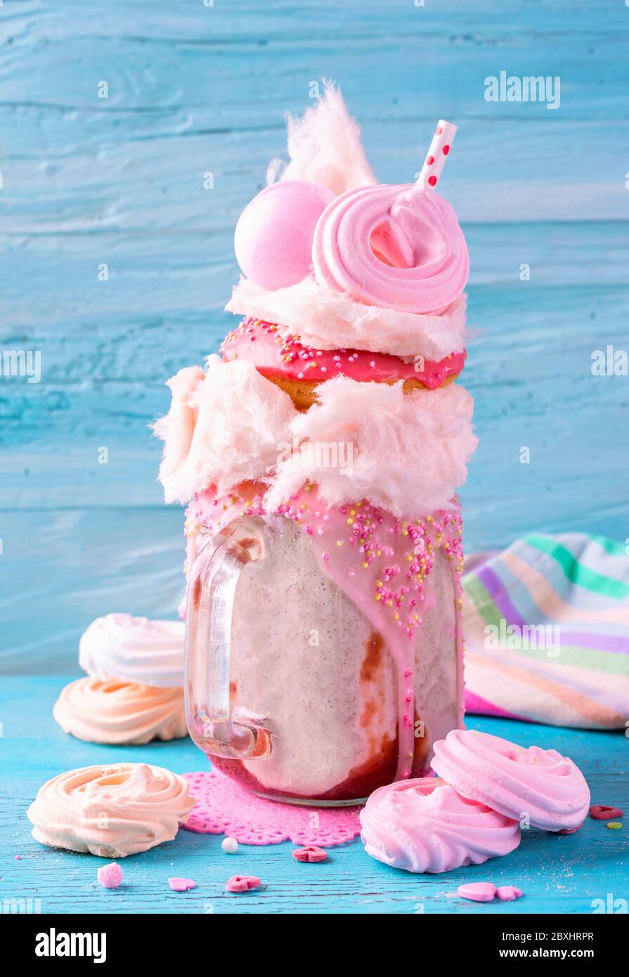 Strawberry freakshake with donuts and candy floss Stock Photo - Alamy