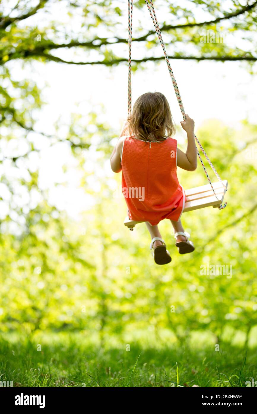 Child on a swing Stock Photo - Alamy