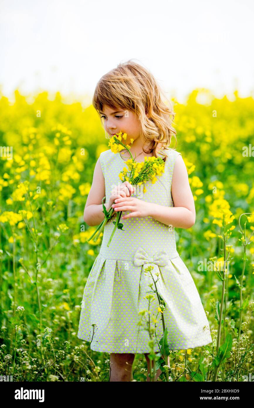 Girl with yellow flowers hi-res stock photography and images - Alamy