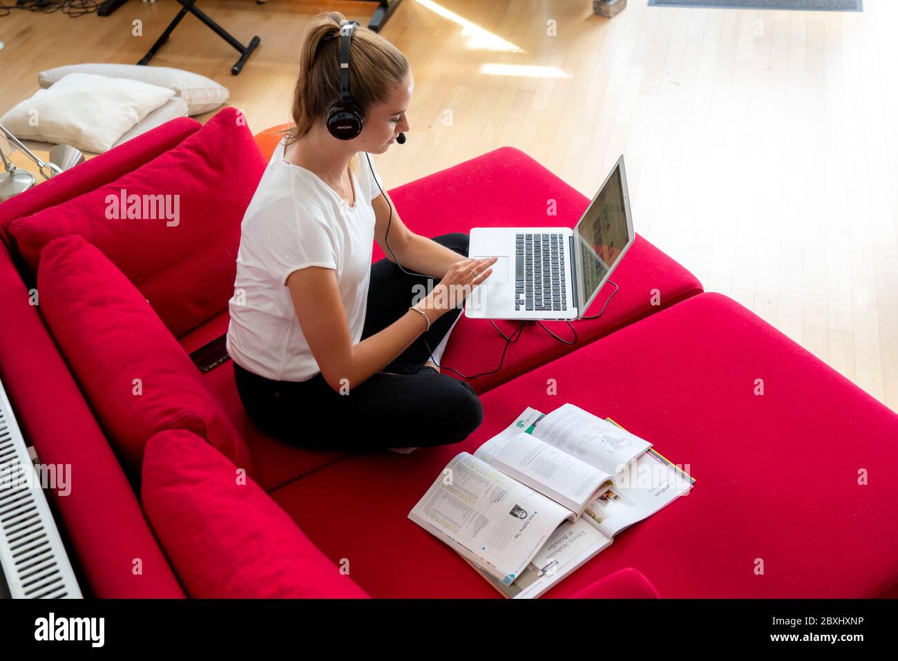 Young student learns at home, online, in conversation with other ...