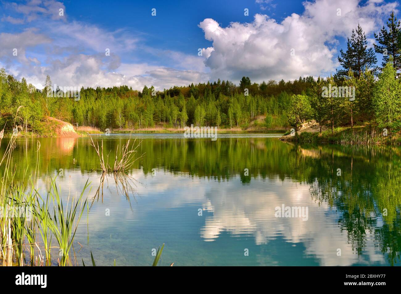 Colorful summer landscape of the lake with clear water with a turquoise ...