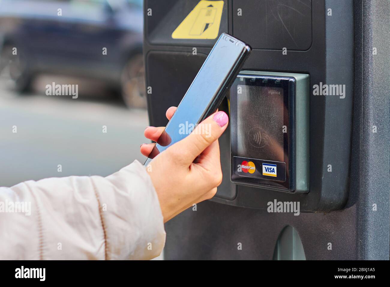 Payment for parking using contactless NFC technology supported Visa and ...