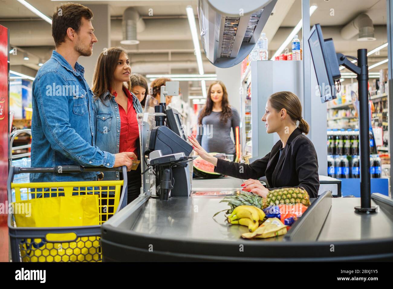 People buying goods in a grocery store Stock Photo - Alamy