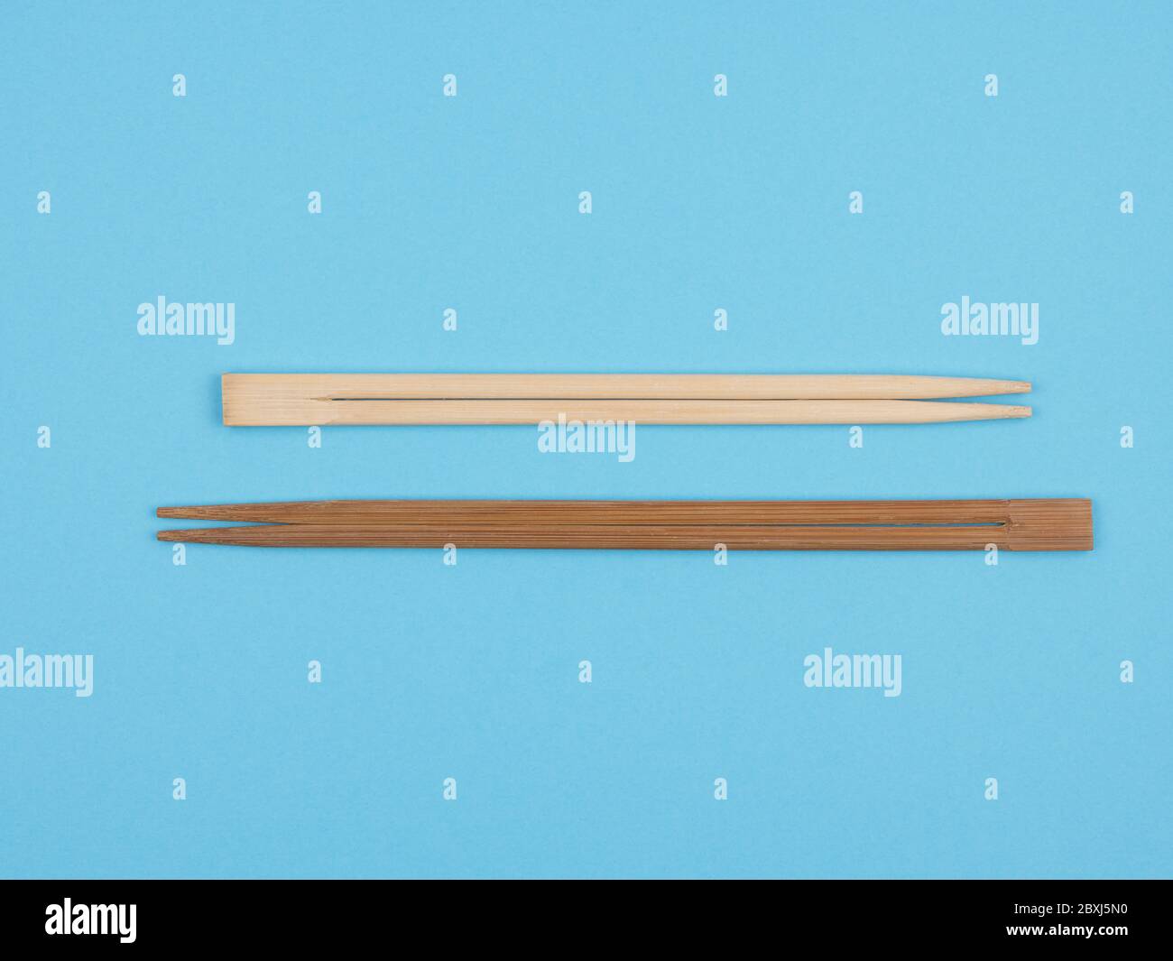 Sushi sticks on a blue background Stock Photo - Alamy