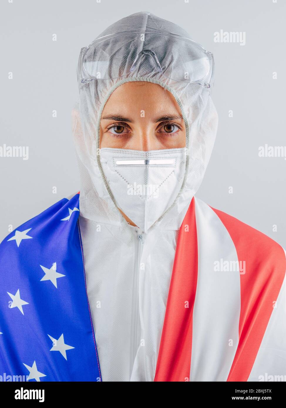American woman doctor in uniform, medical cap and mask, close-up ...