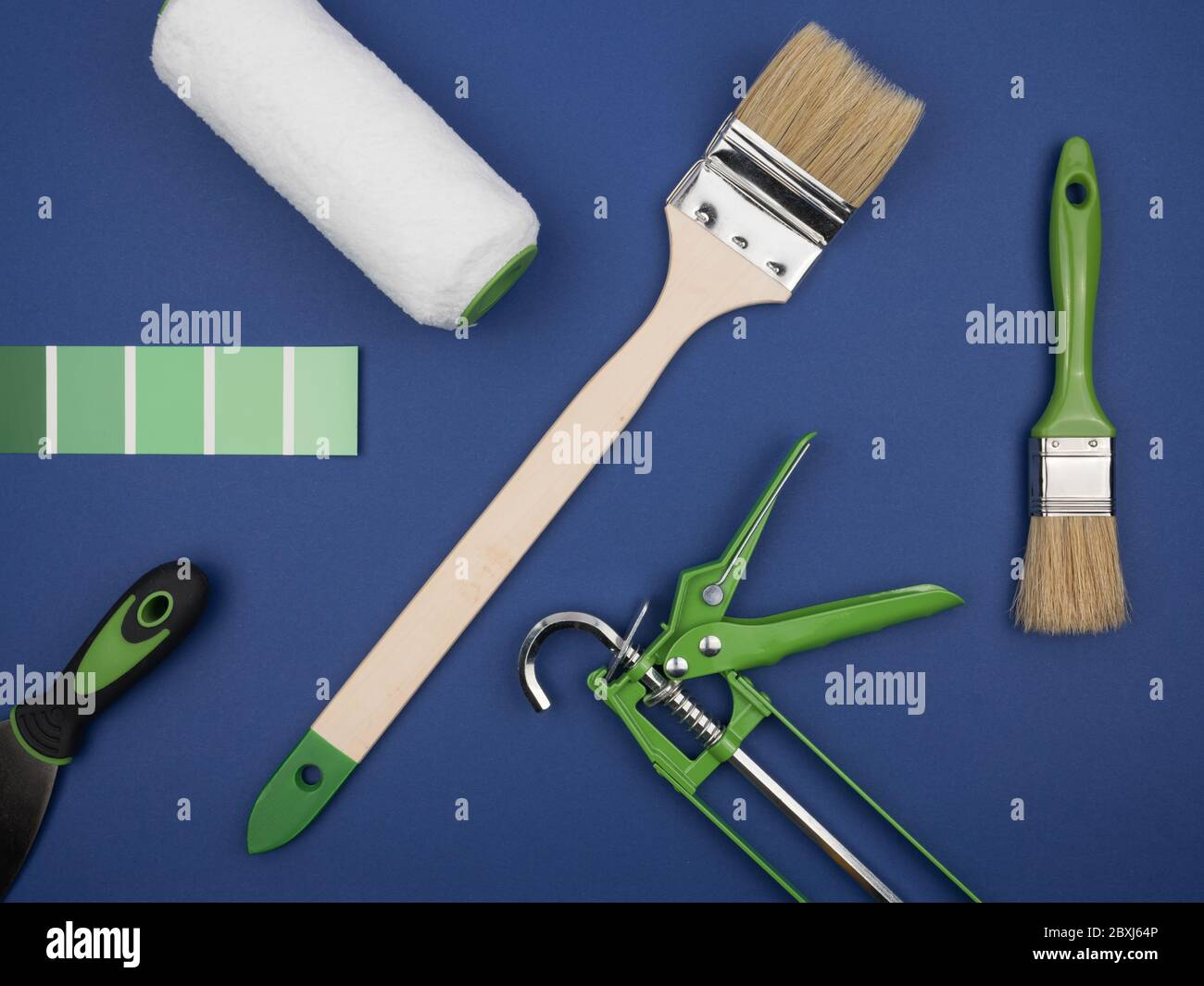 Tool for finishing works in the repair. Blue background Stock Photo - Alamy