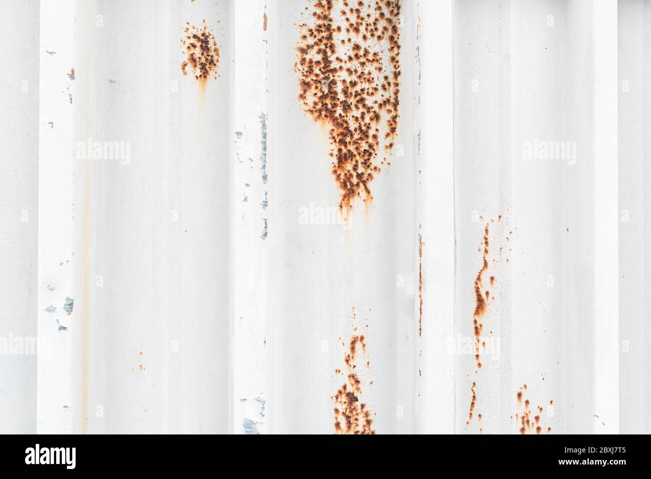 Red spots of rust on the white metal texture construction copy space ...