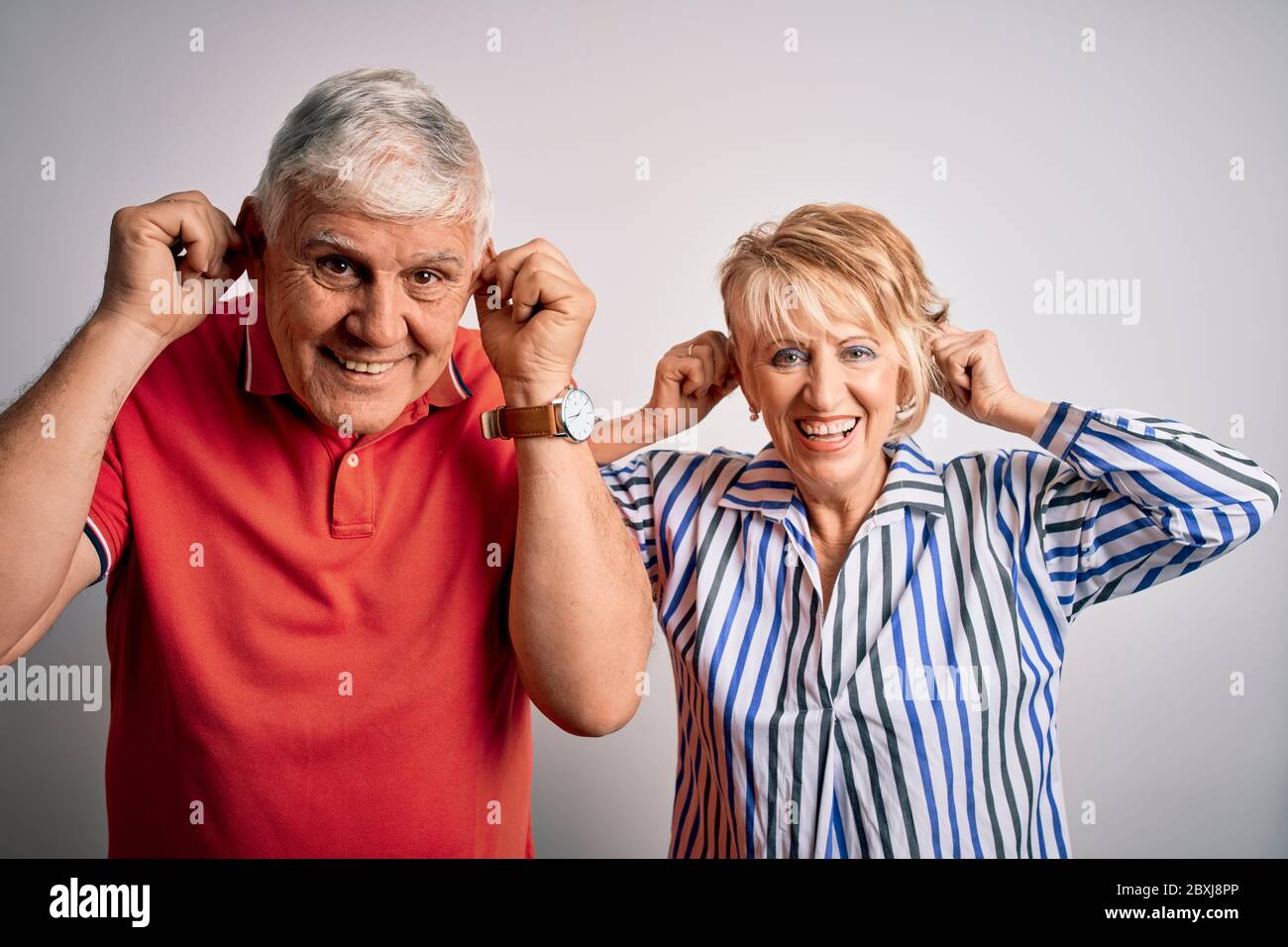 Senior beautiful couple standing together over isolated white ...