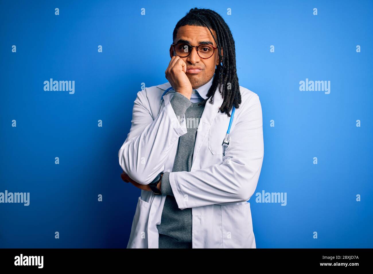 Young african american doctor man with dreadlocks wearing stethoscope ...